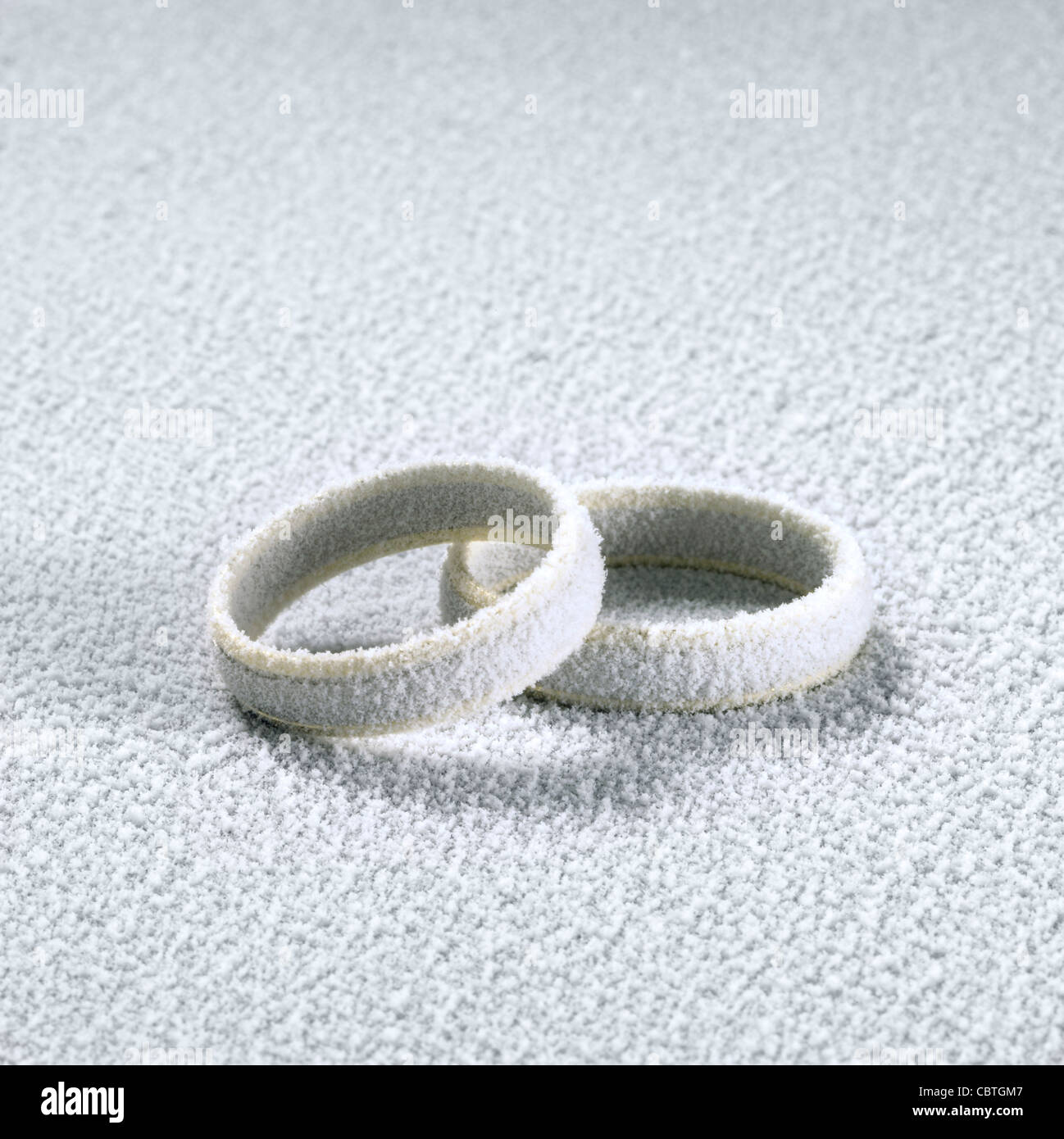 studio photography of two frosted wedding rings in cold ambiance Stock ...