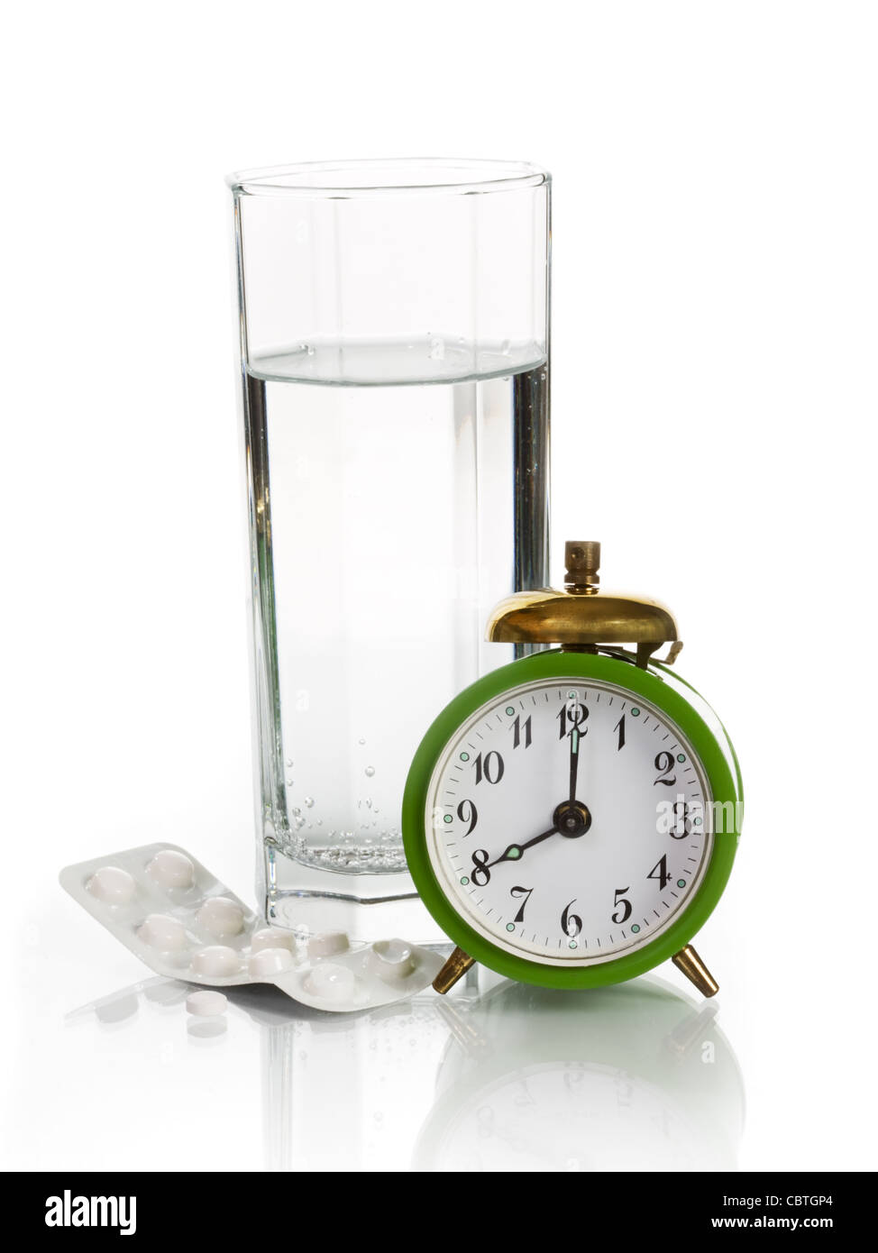 Alarm clock, tablets and glass of water on white background Stock Photo ...