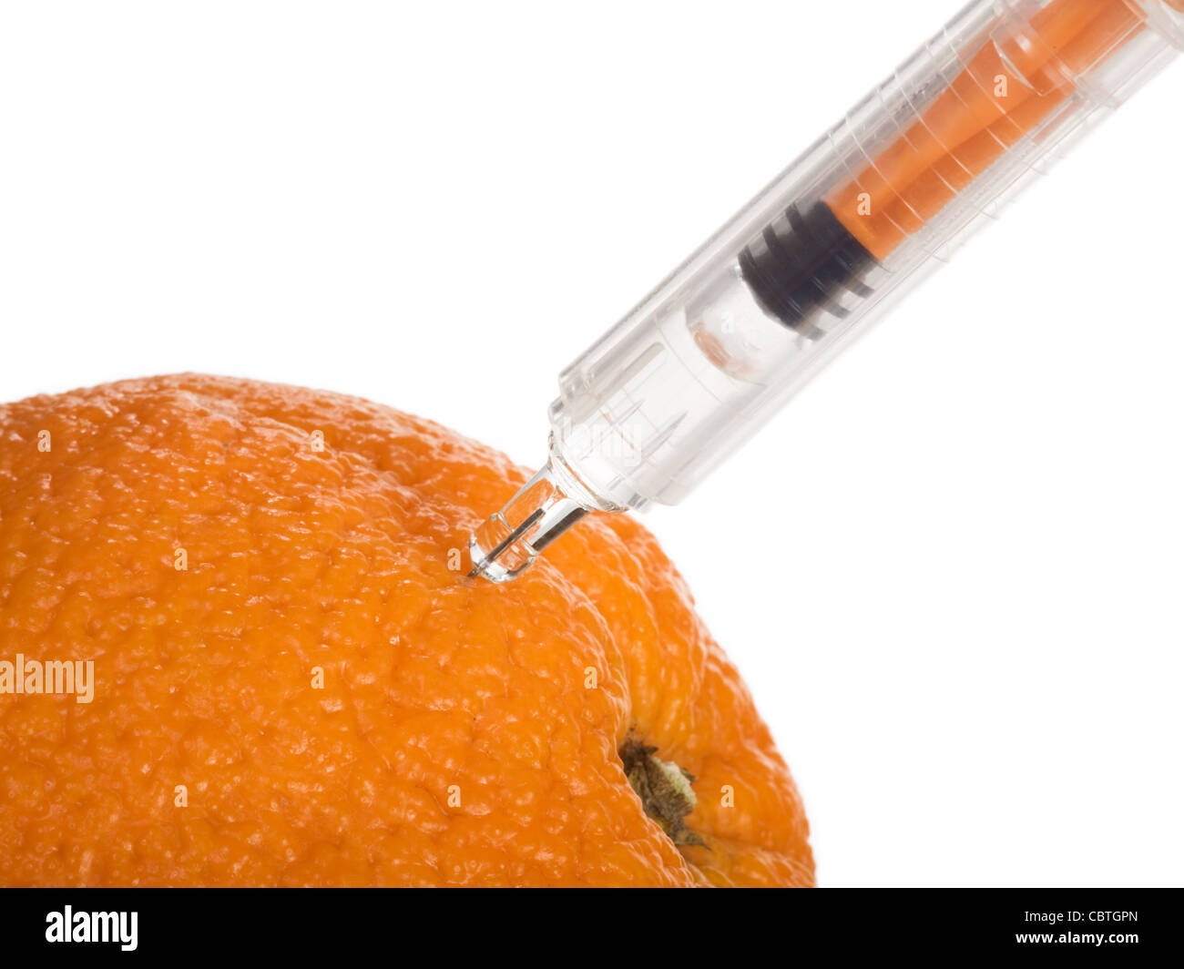Syringe injecting orange fruit hi-res stock photography and images - Alamy