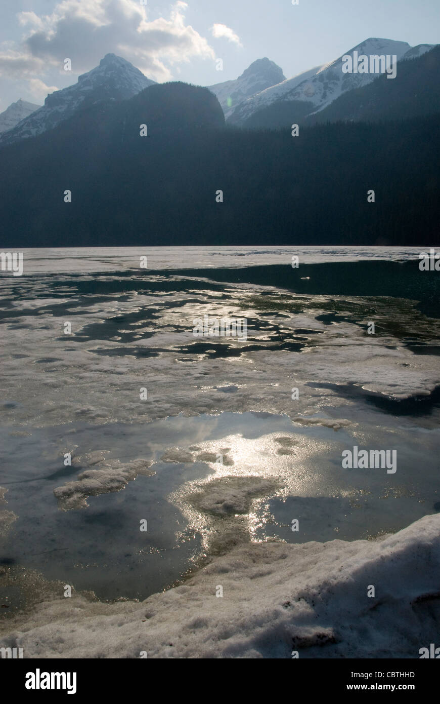 Frozen lake and mountains, Lake Louise, Banff, Alberta, Canada Stock ...