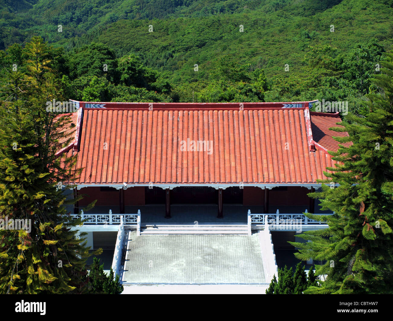 A Chinese temple is surrounded by lush green forests Stock Photo - Alamy