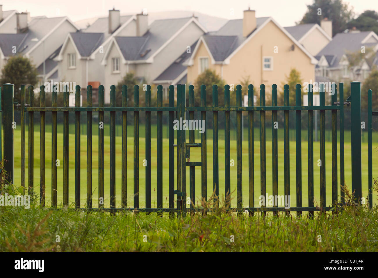 Locked gate to field in front of housing estate, Dunmanway, County Cork ...