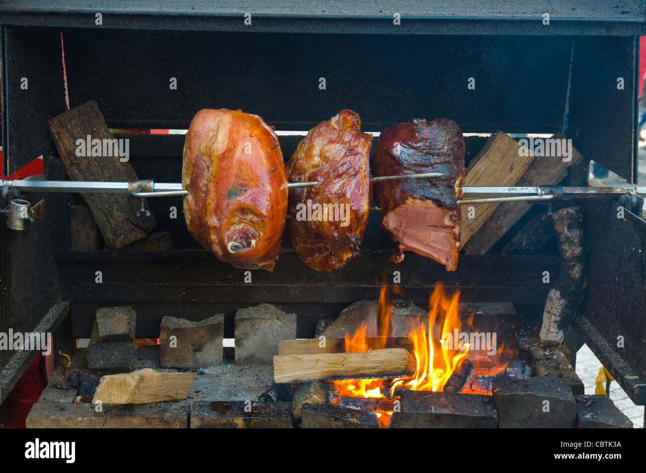 Ham fried on open fire during Christmas market at Vaclavske namesti ...