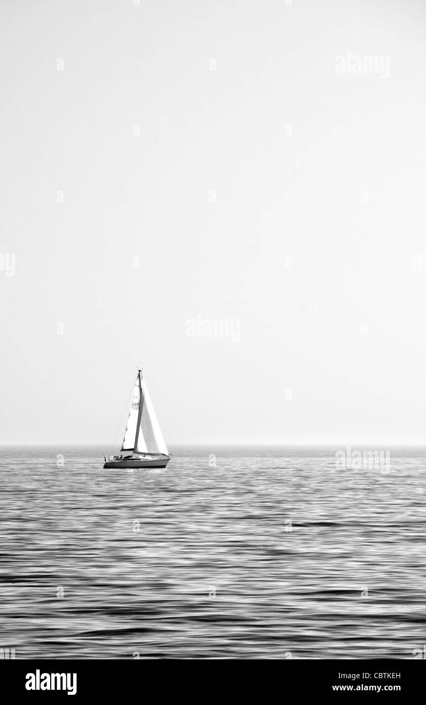 Sailing boat on waves Black and White Stock Photos & Images - Alamy
