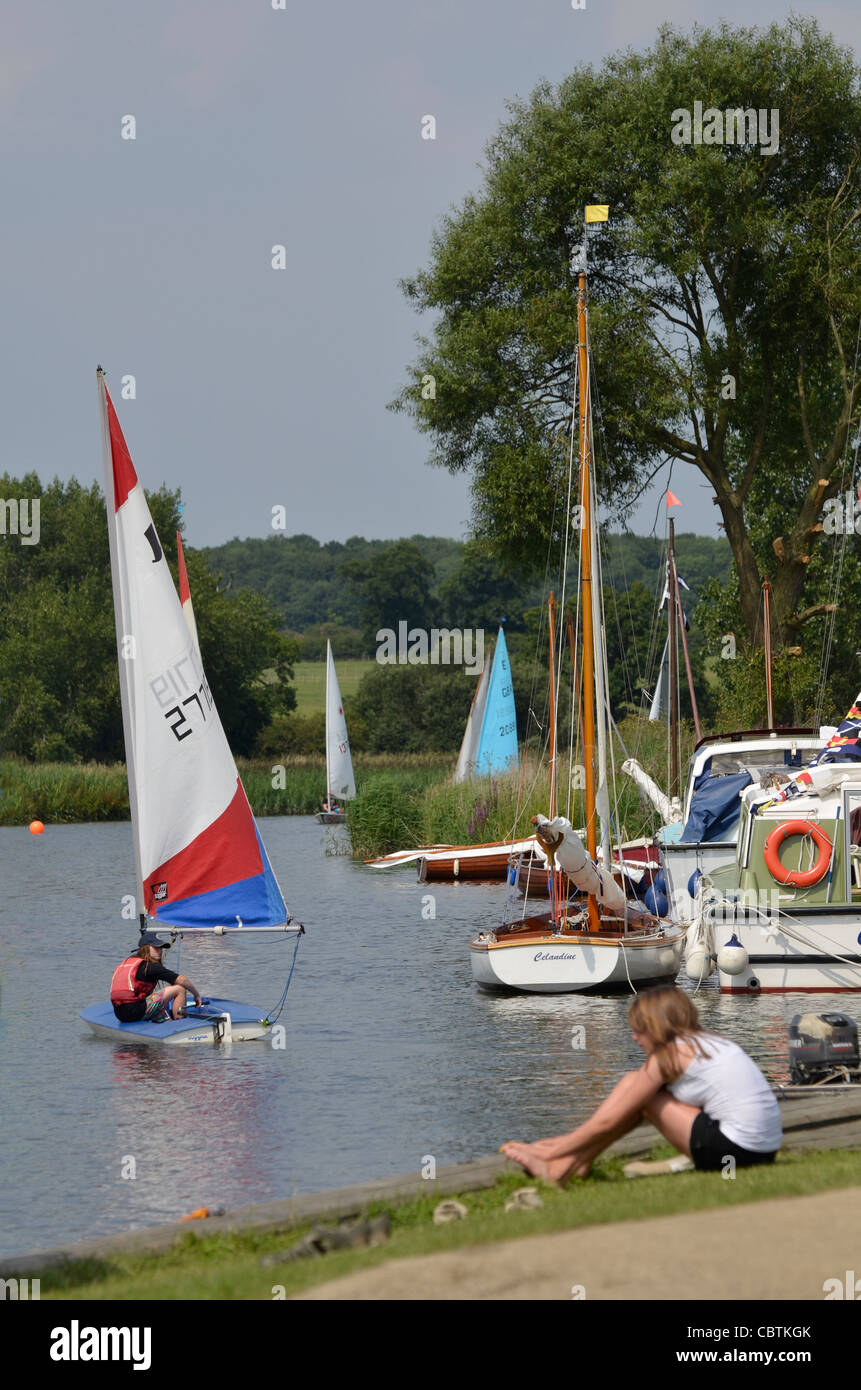 girl watching sailling boats at beccles suffolk uk Stock Photo - Alamy
