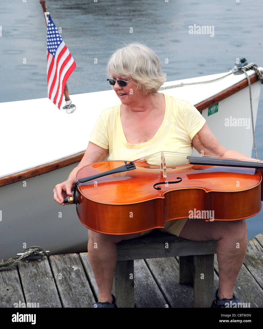 Female cellist with her cello Stock Photo - Alamy