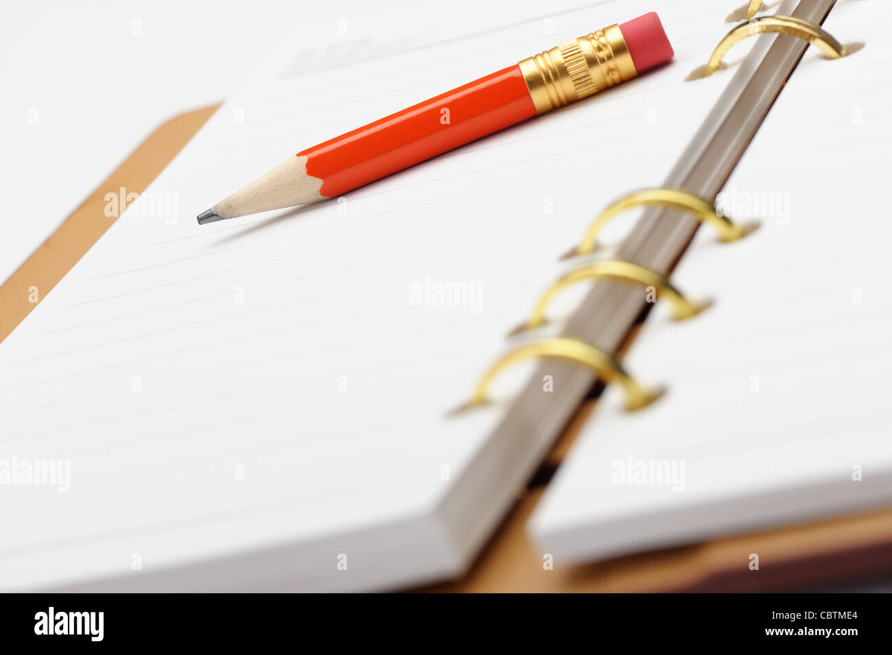Open notebook with copper binding and red pencil. Photo closeup Stock ...