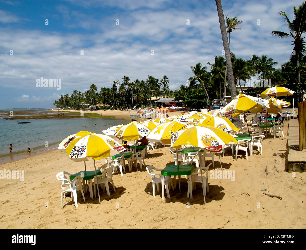 Beachside cafe with a background of palm trees on the lovely beach at ...