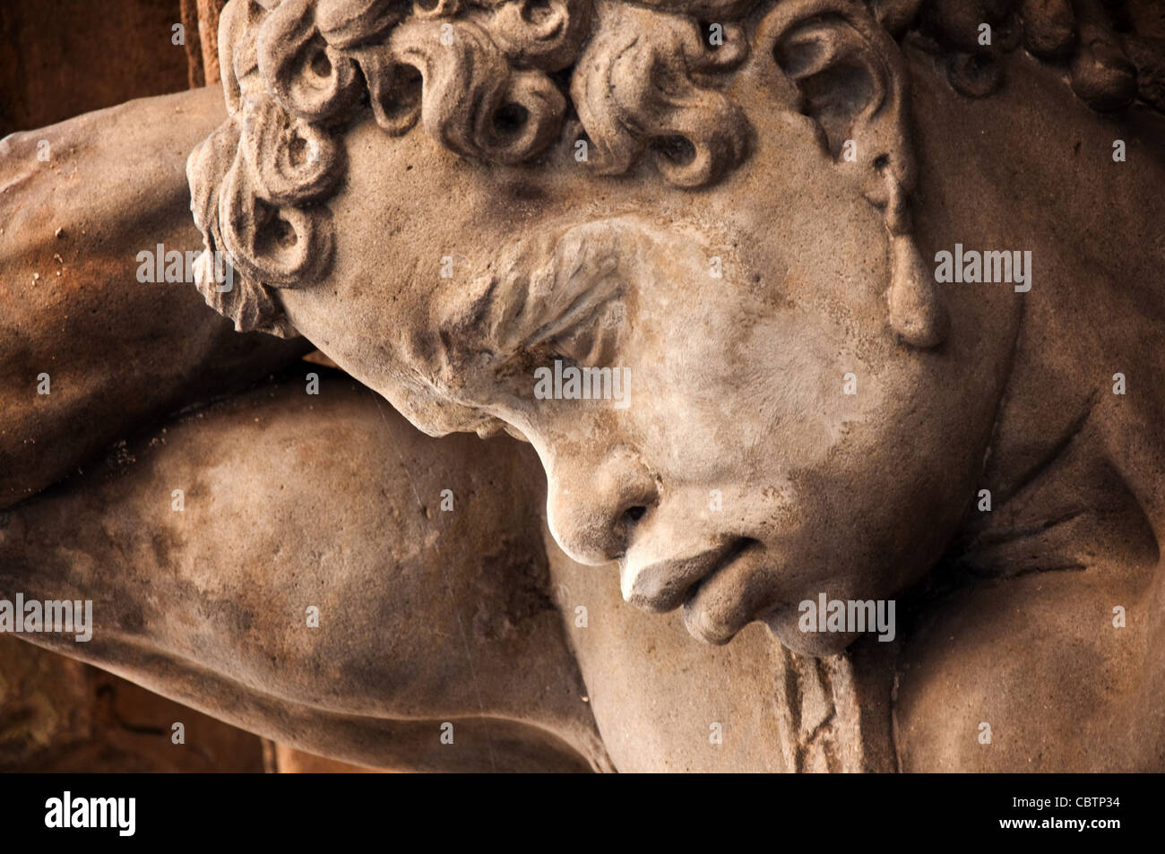 huge male head carved in stone, detail from Prague Stock Photo - Alamy