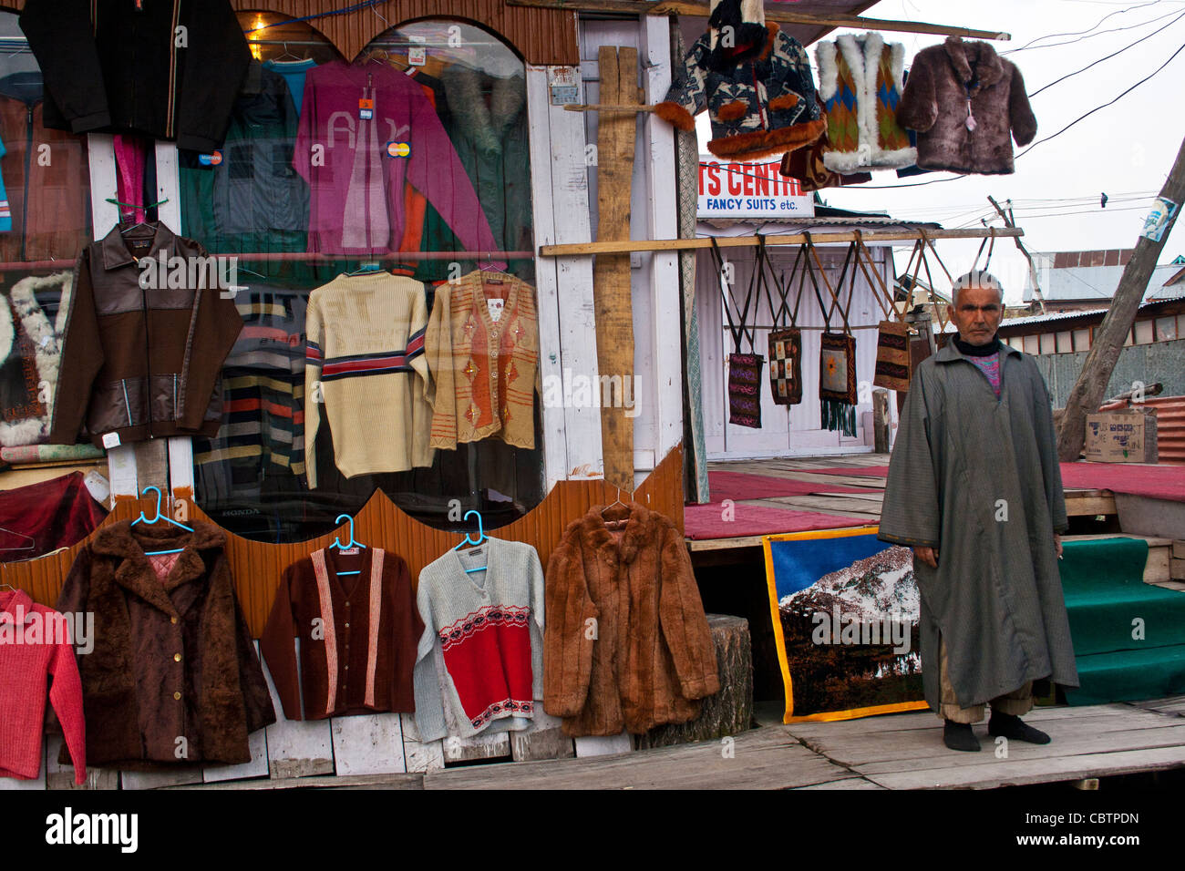 A Kashmiri shopkeeper in a textile and gift shop in Dal lake's floating ...
