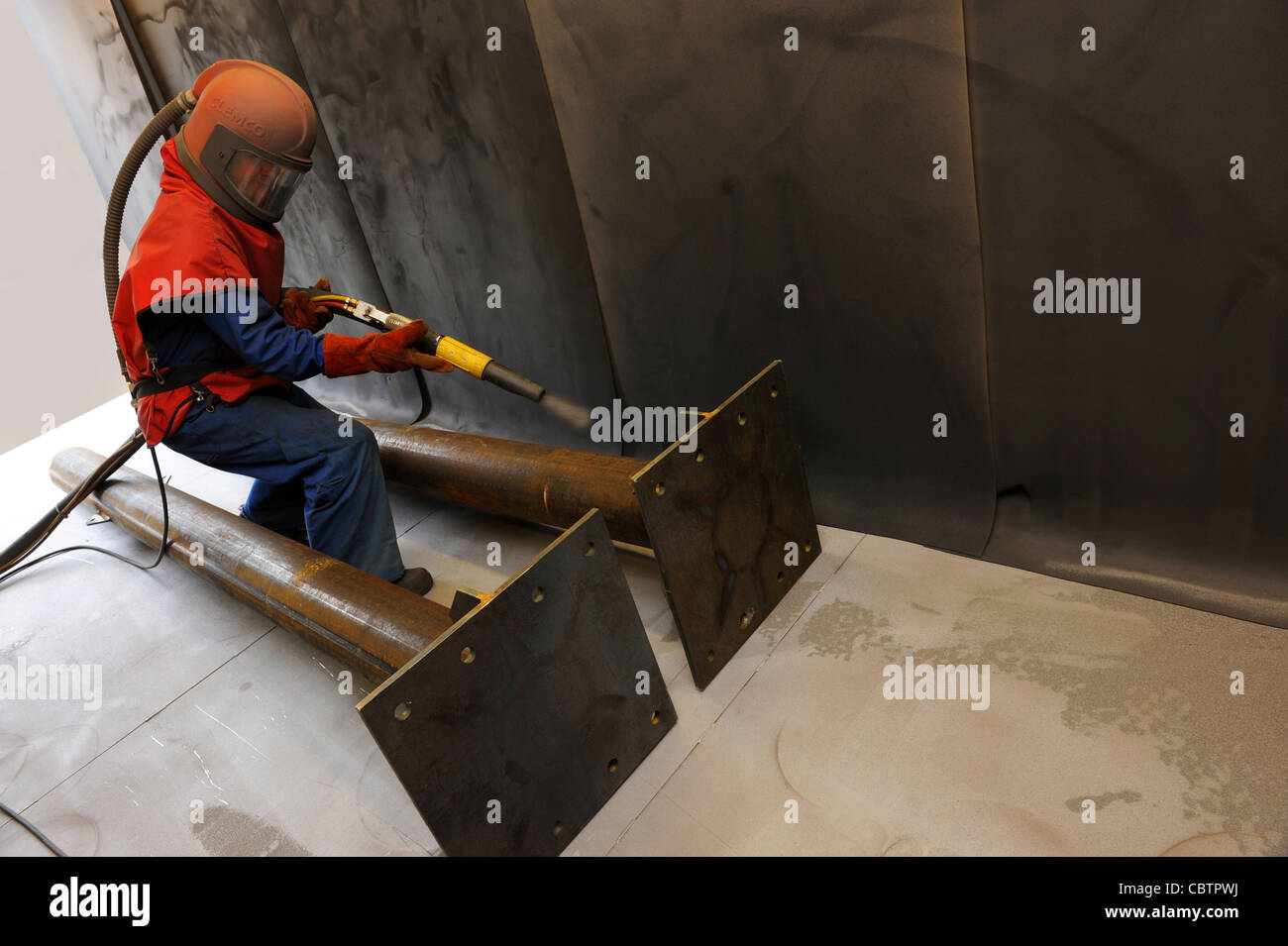 Shot blasting chamber for cleaning steel Stock Photo - Alamy