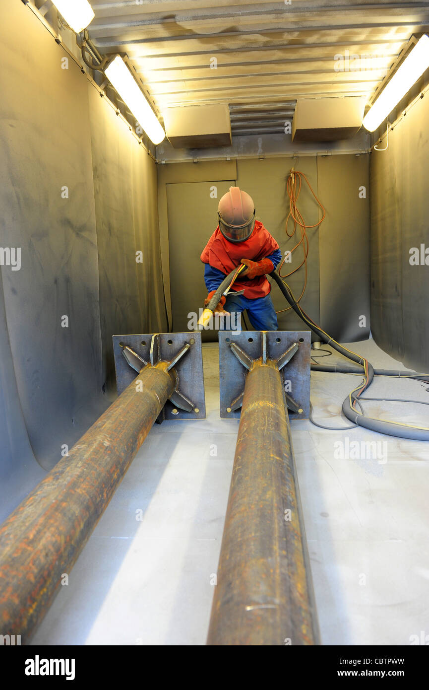 Shot blasting chamber for cleaning steel Stock Photo - Alamy