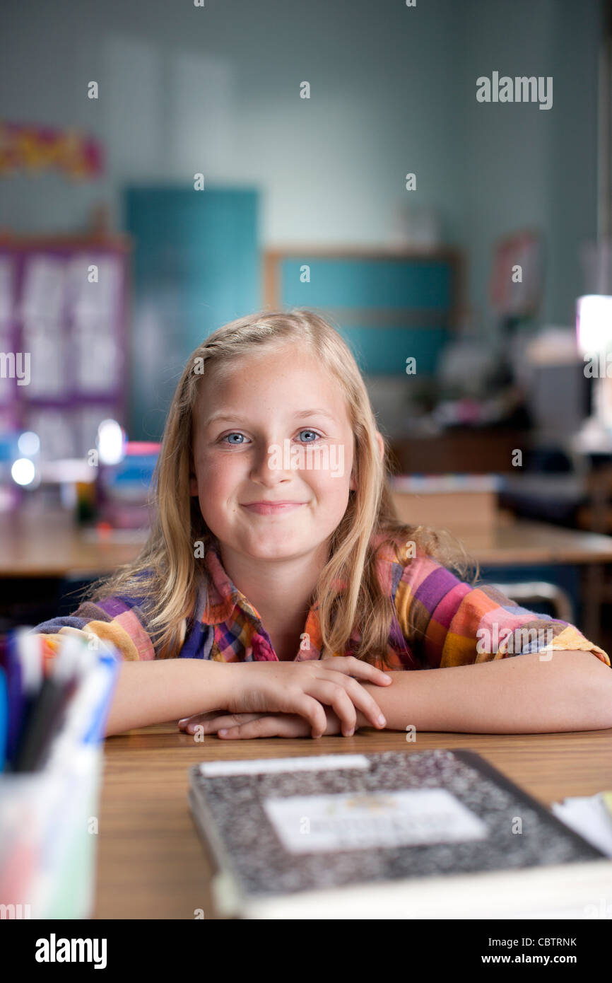 Girl sitting on desk posing hi-res stock photography and images - Alamy