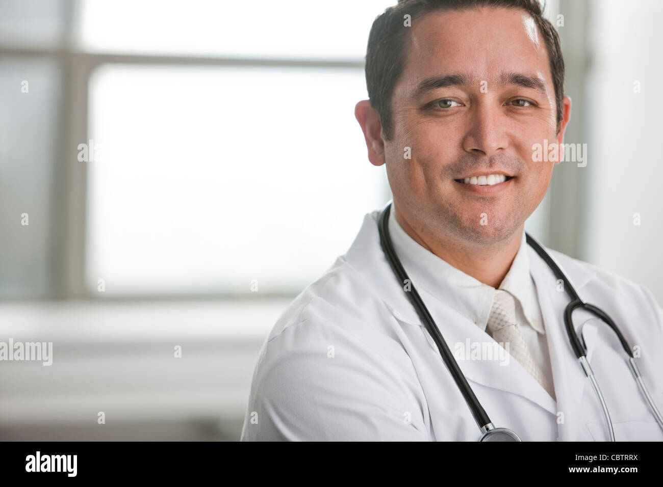 Smiling mixed race doctor Stock Photo - Alamy