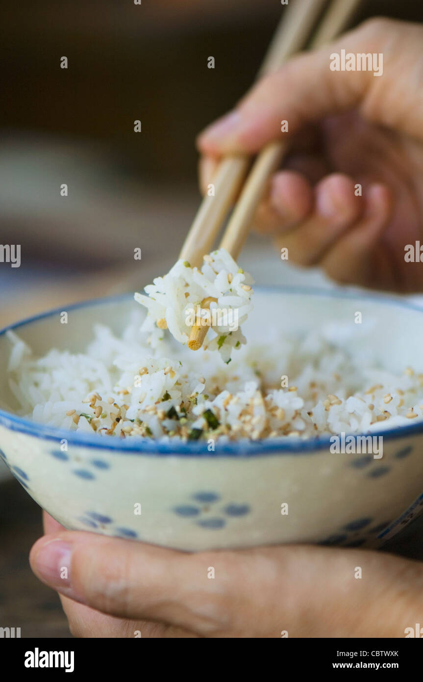 Holding Bowl Of Rice High Resolution Stock Photography and Images - Alamy