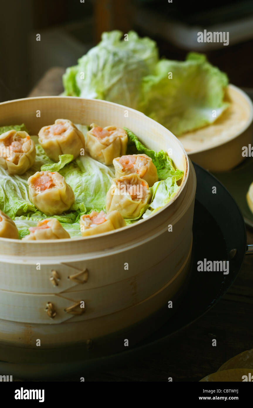 Asian dumplings in steamer with cabbage Stock Photo - Alamy