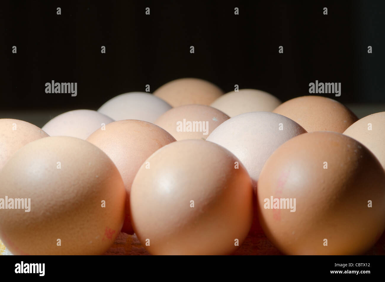 A group of chicken eggs arranged in a triangle, a dozen eggs Stock ...