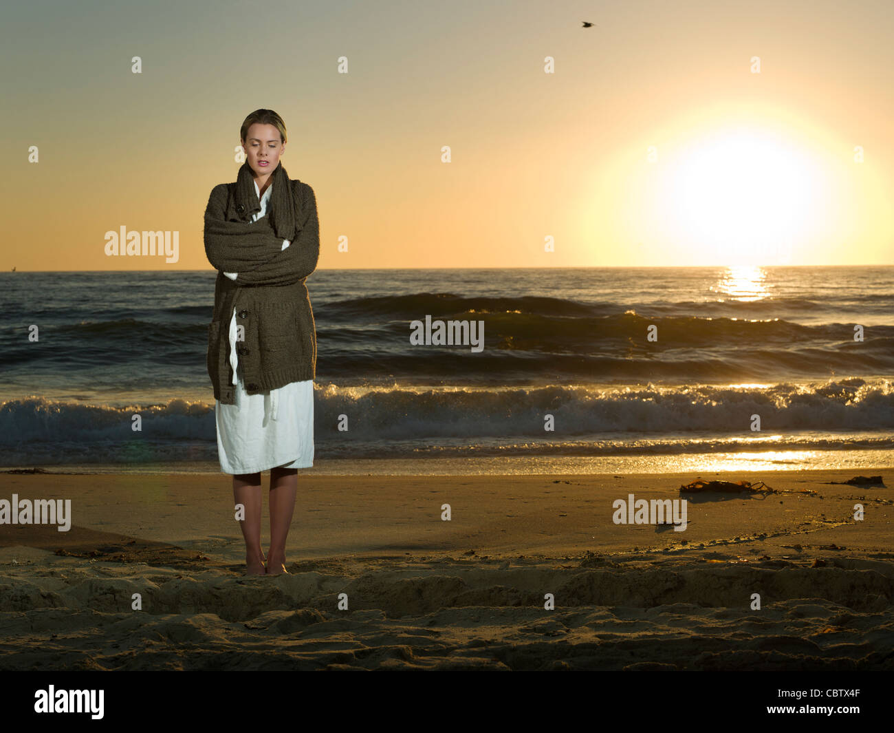 Sunset woman beach standing hi-res stock photography and images - Alamy
