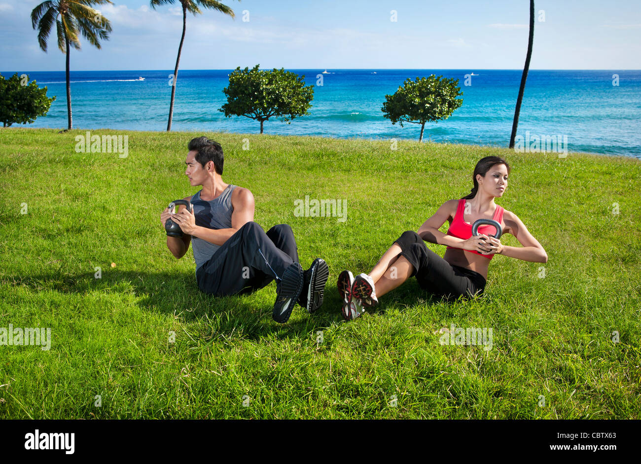 Couple exercising together at waterfront Stock Photo - Alamy