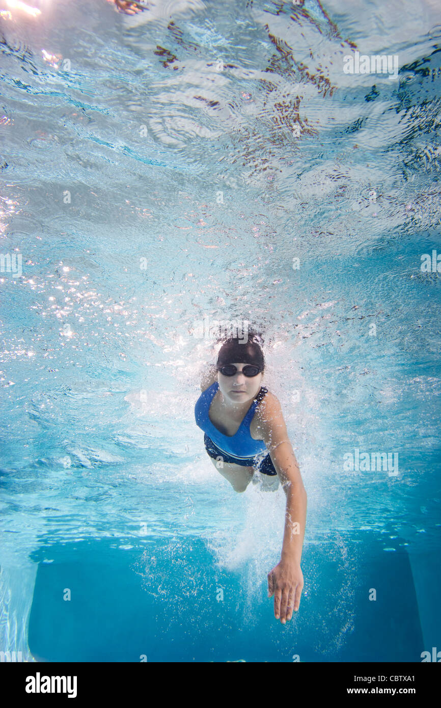 Caucasian woman swimming in swimming pool Stock Photo - Alamy