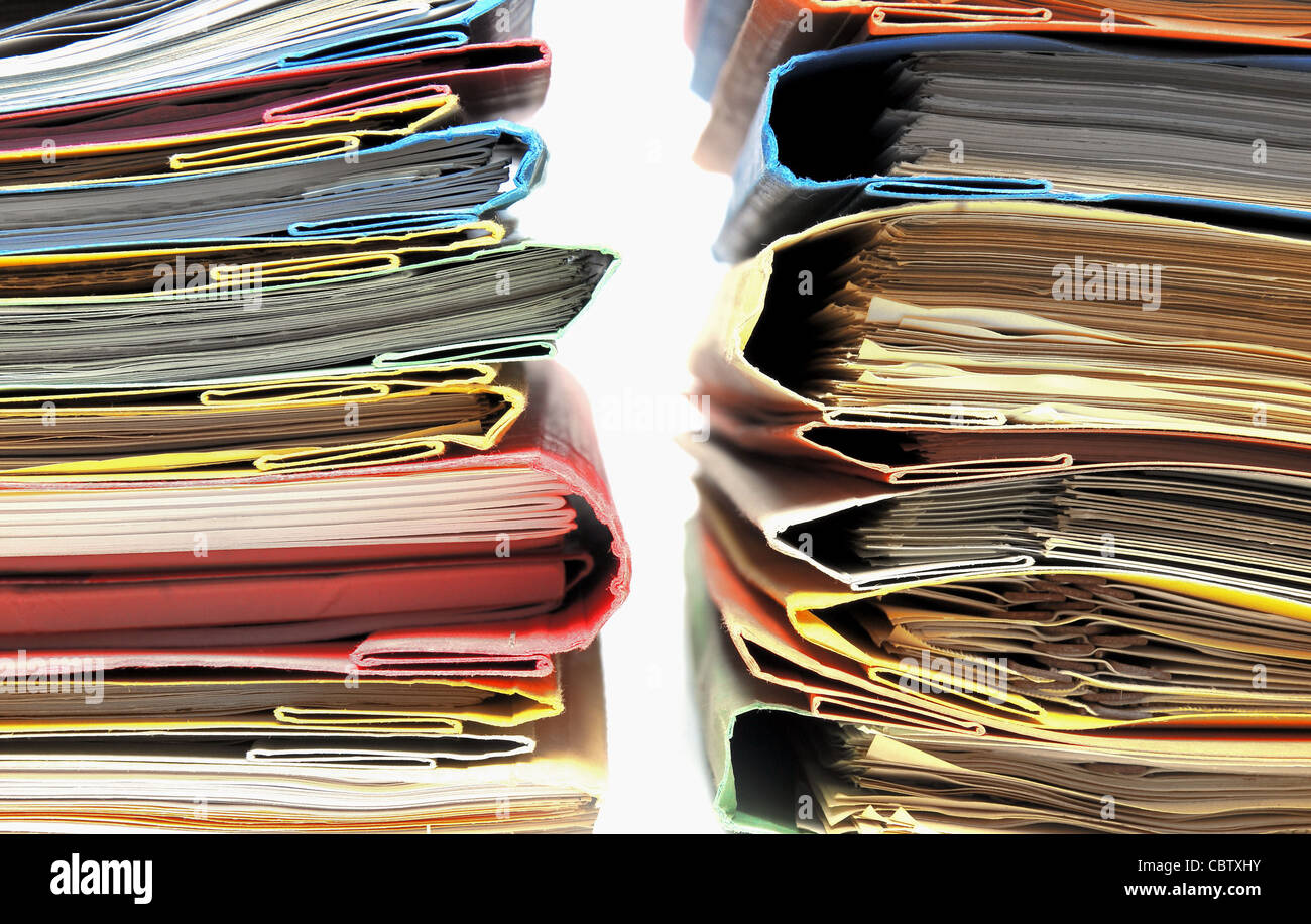 Two stacks of colorful office folders over white background Stock Photo ...