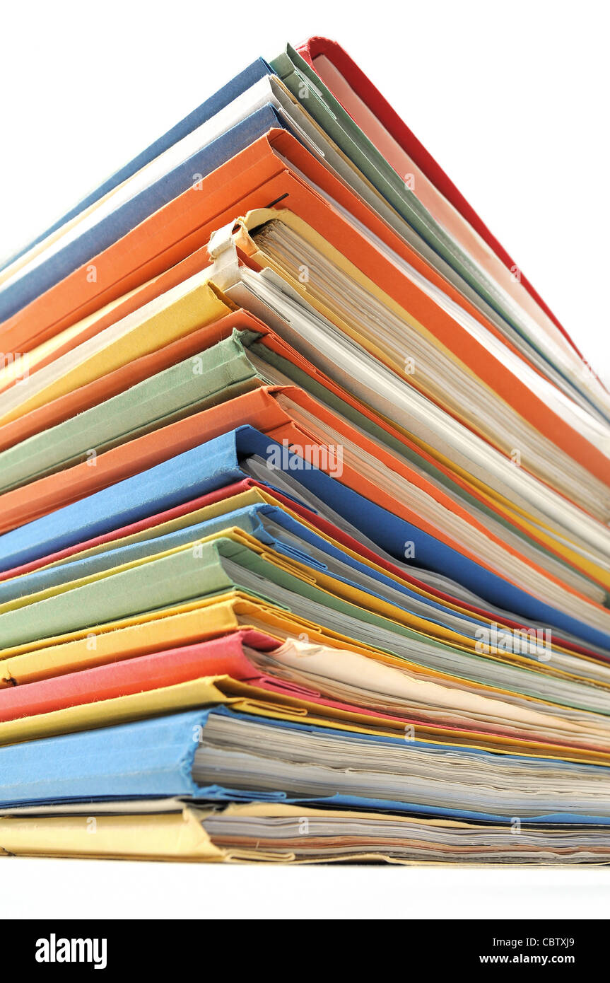 Pile of colorful office binder over white background Stock Photo - Alamy