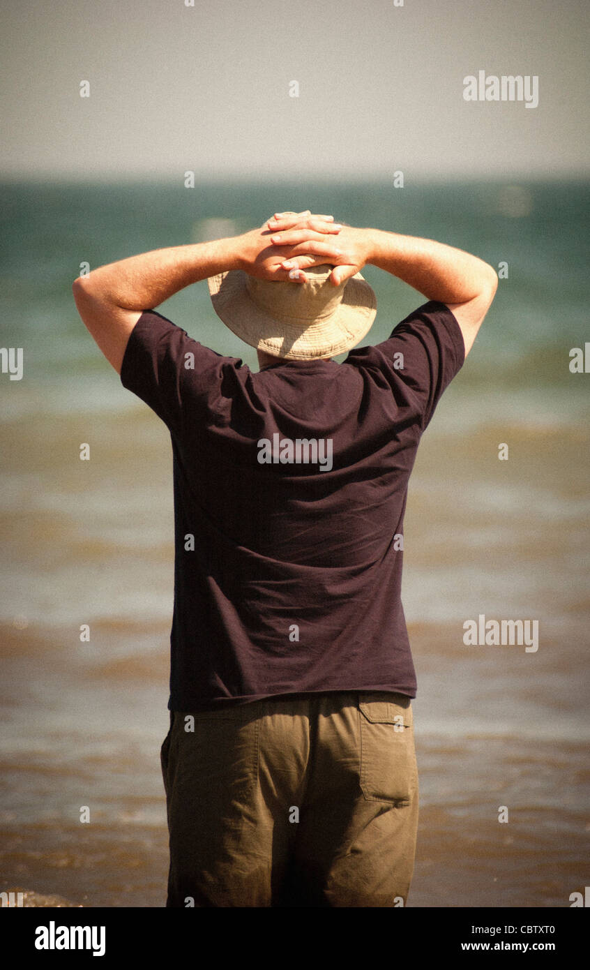 Rear view of a mature caucasian man, casually dressed in a black t ...