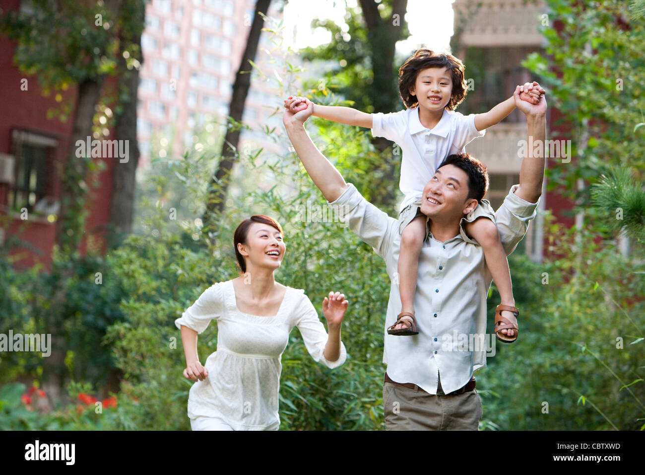 Family having fun in a common community Stock Photo - Alamy
