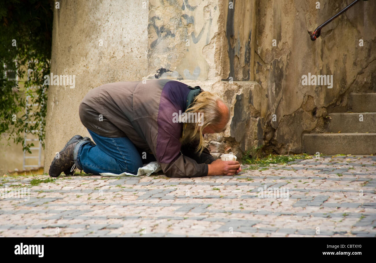 Beggar on the street in Prague, begging money Stock Photo - Alamy