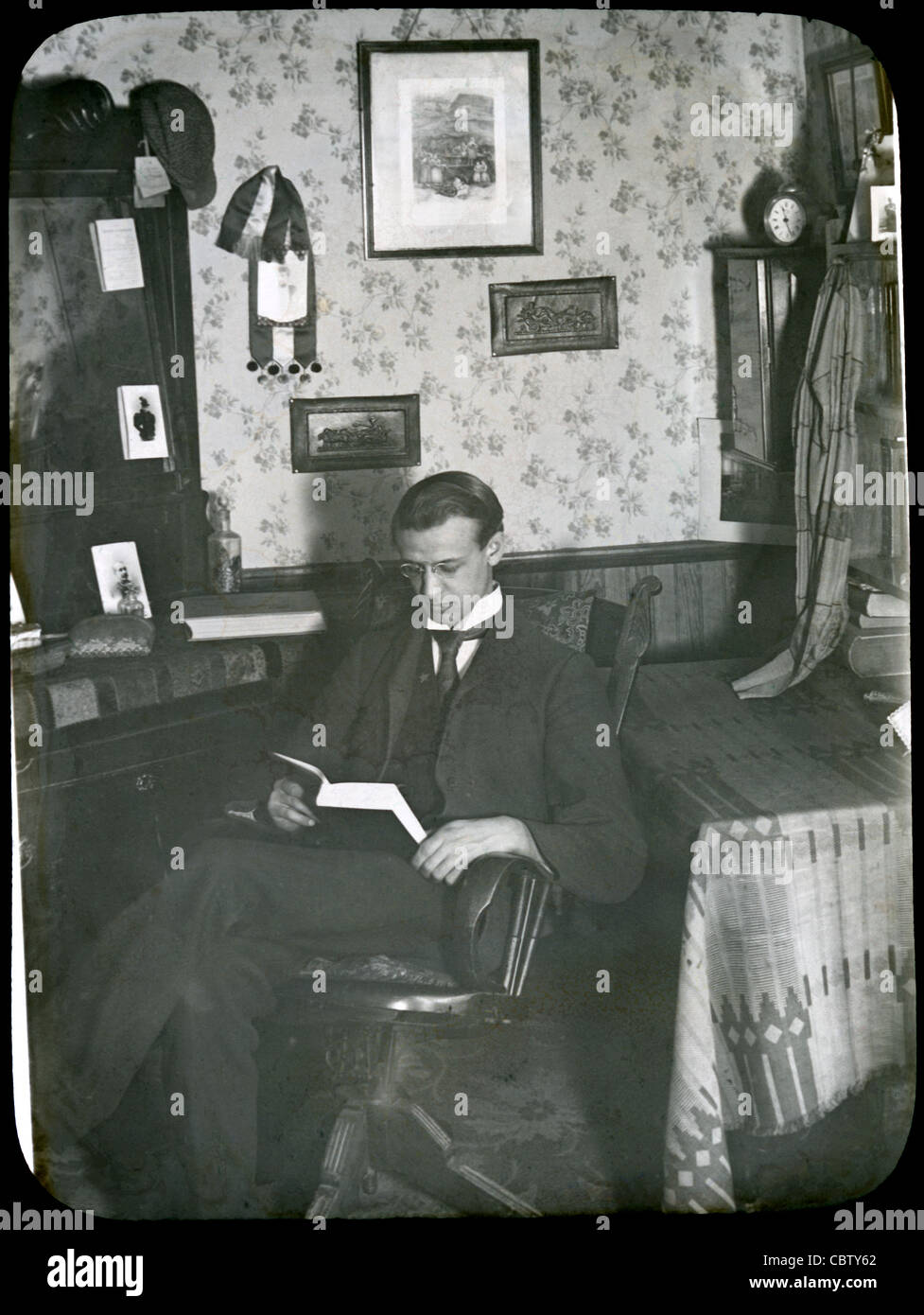 Circa 1900 view of a man in his Victorian parlor or study Stock Photo ...