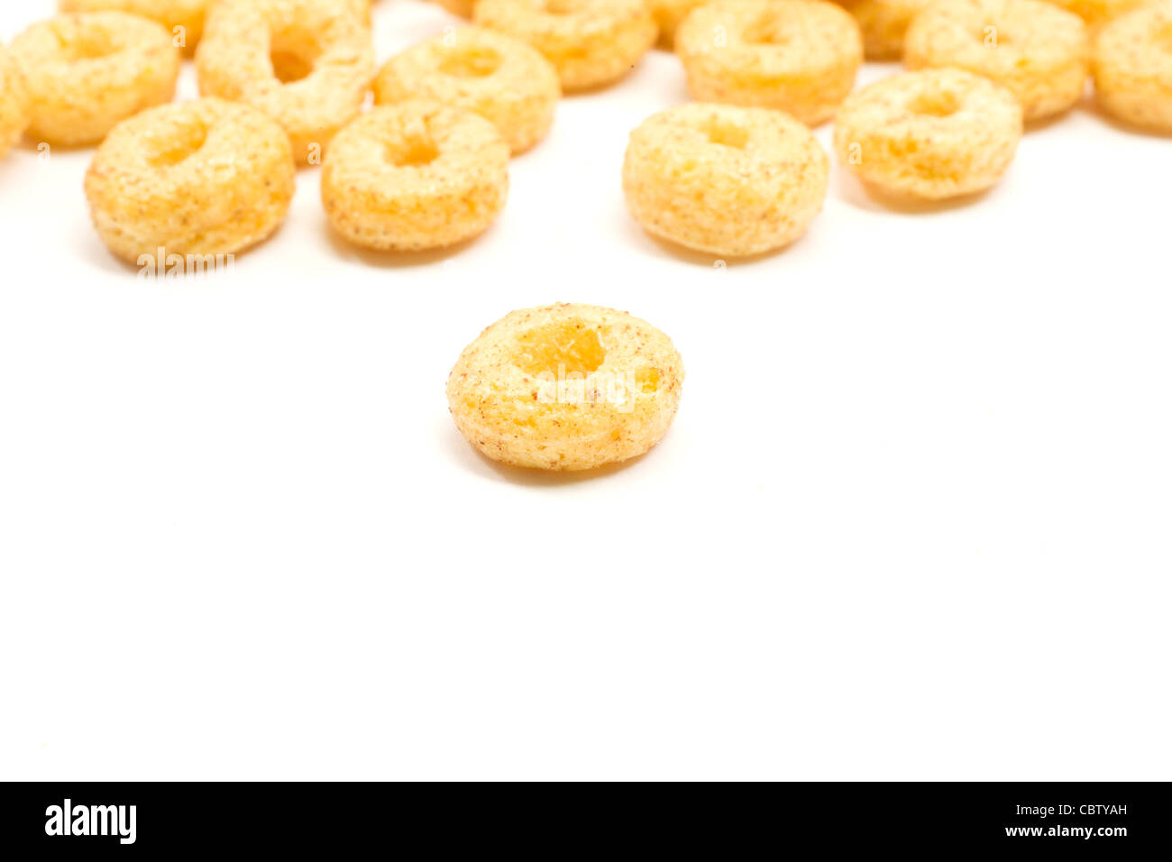 A close up of a single cinnamon circle o cereal piece in a macro shot ...