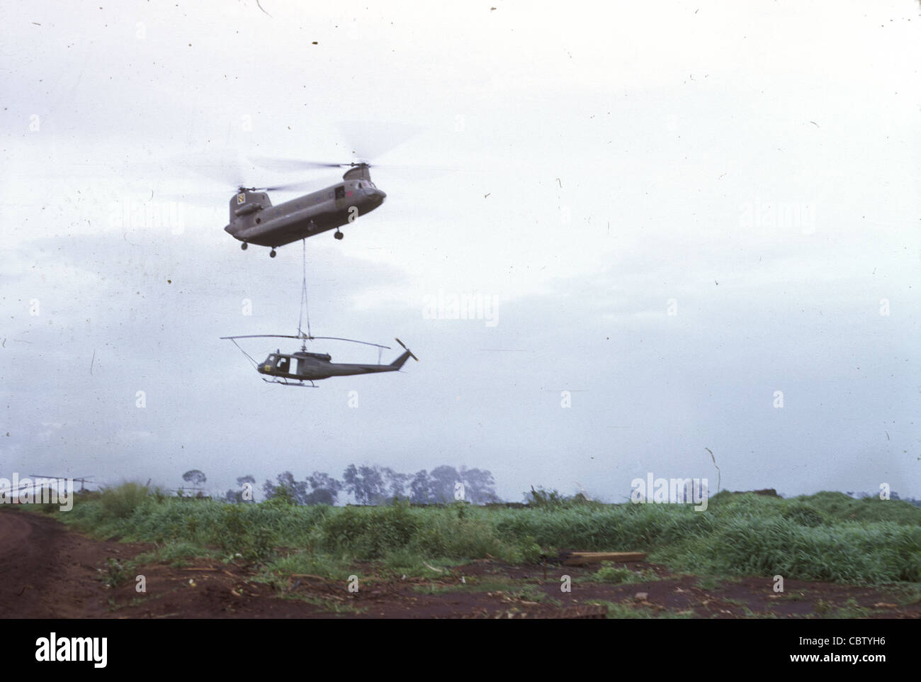 Chinook helicopter carrying UH-1H huey of Bravo Troop, 1st Squadron ...