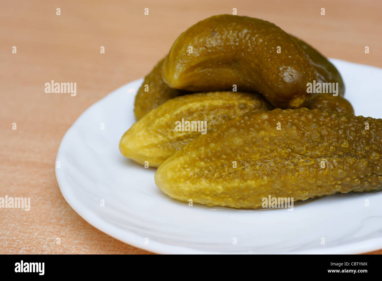 dill pickle on plate, pickles Stock Photo - Alamy