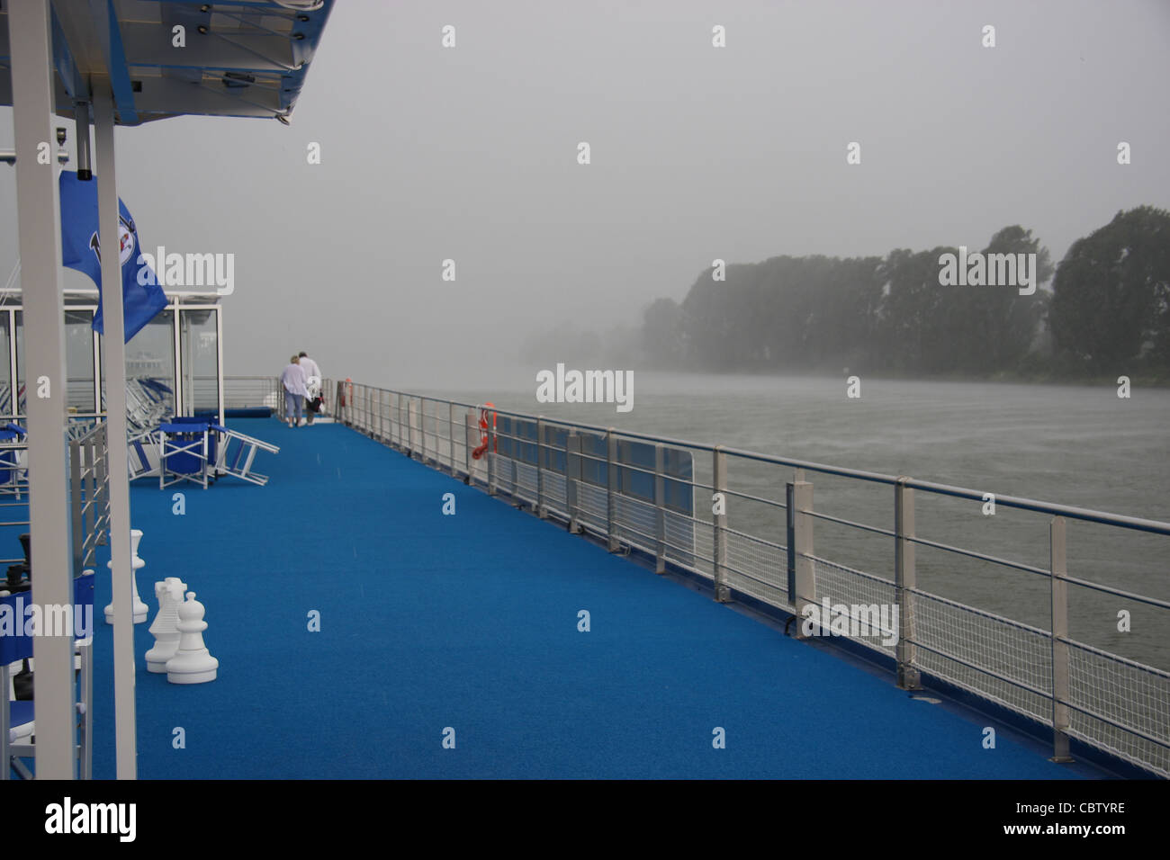 Heavy rain squall on the Rhine River near Rhens, Germany obscures ...