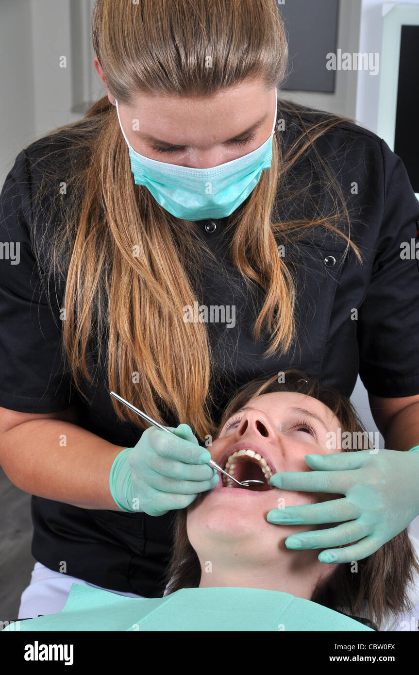 Woman having her regular dental checkup at the dentist Stock Photo - Alamy