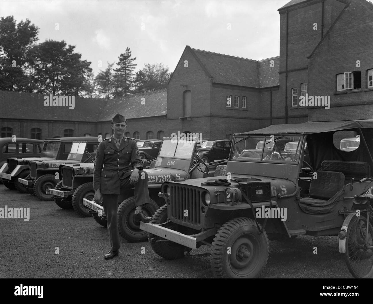 Europe and England during World War II. American GI standing next to ...