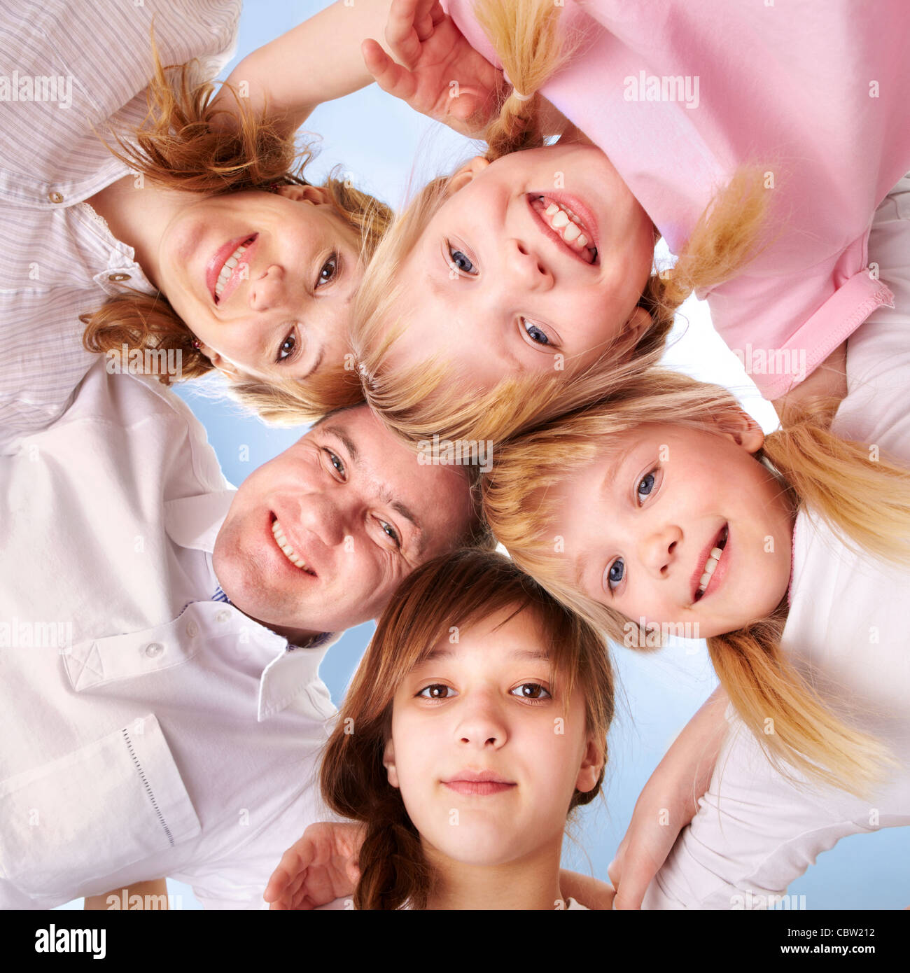 A young friendly family making circle while looking at camera Stock ...