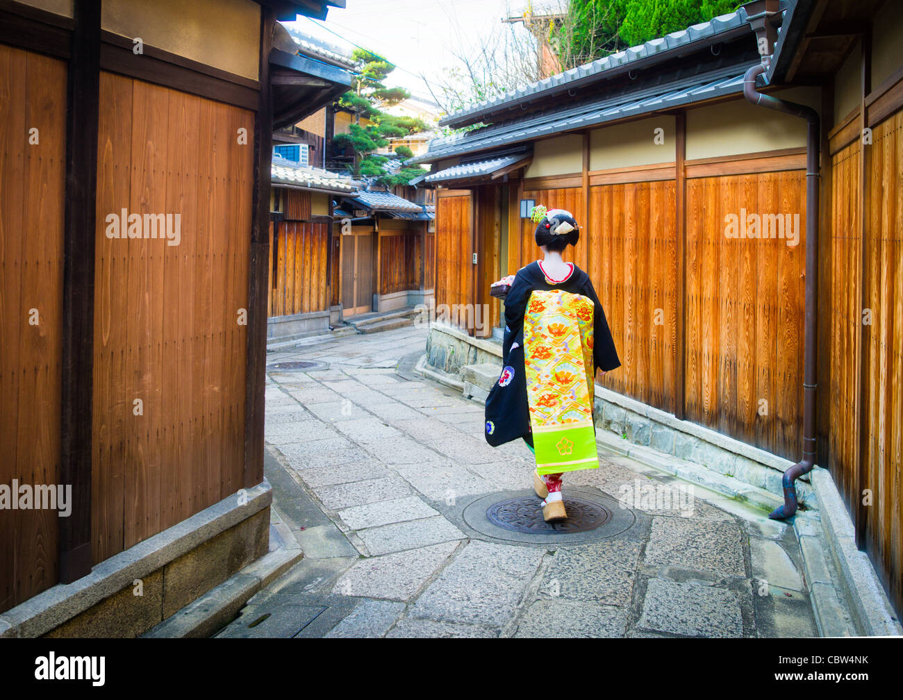 A Maiko (Geisha in training) walks in the back streets of Kyoto - Kyoto ...