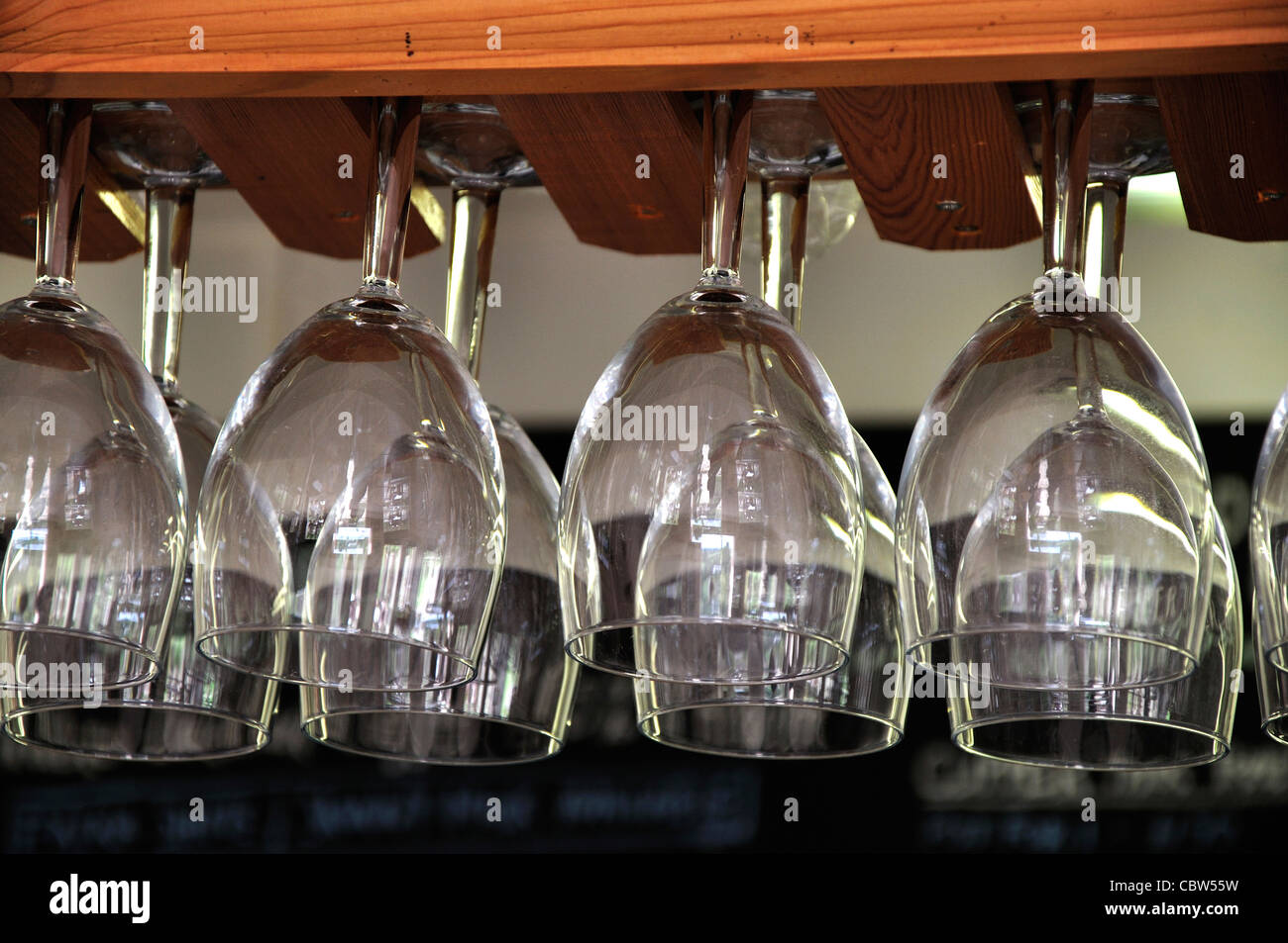 Clean glasses hanging up ready for use UK Stock Photo - Alamy