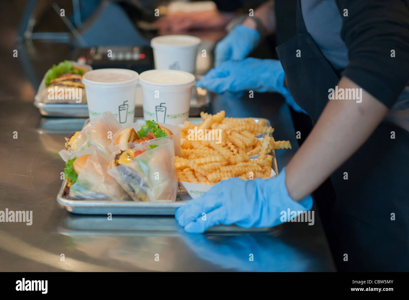 Diners pick up orders at the grand opening of the Shake Shack in ...