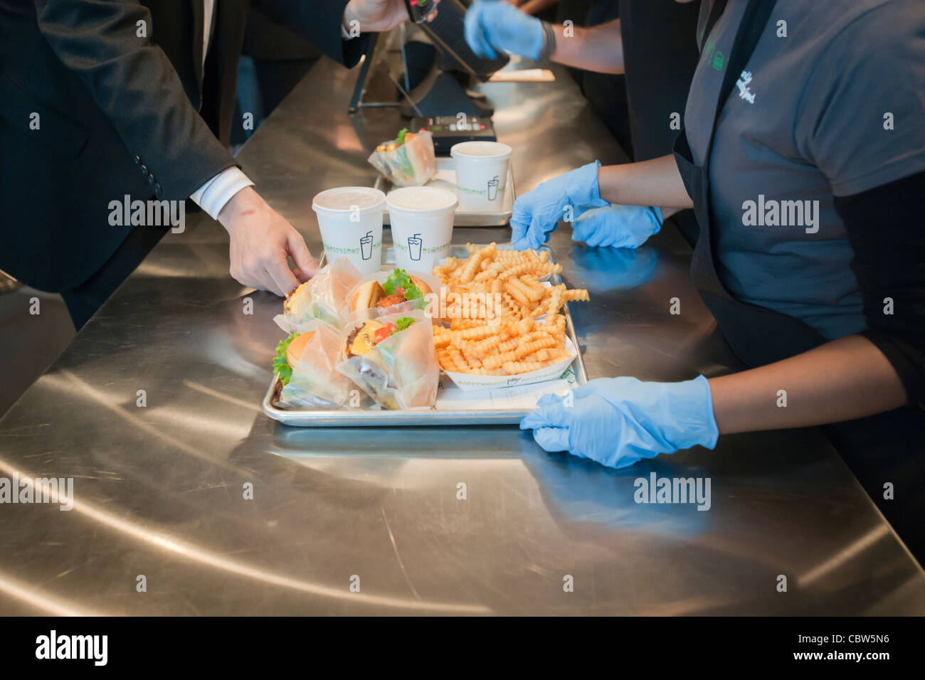 Diners pick up orders at the grand opening of the Shake Shack in ...