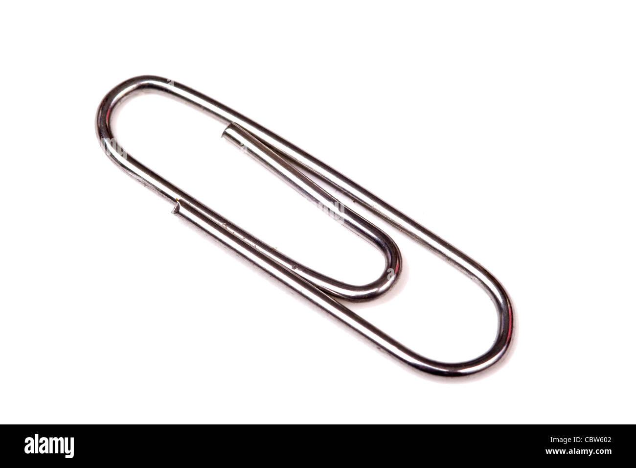 A metal paperclip on a white background Stock Photo - Alamy