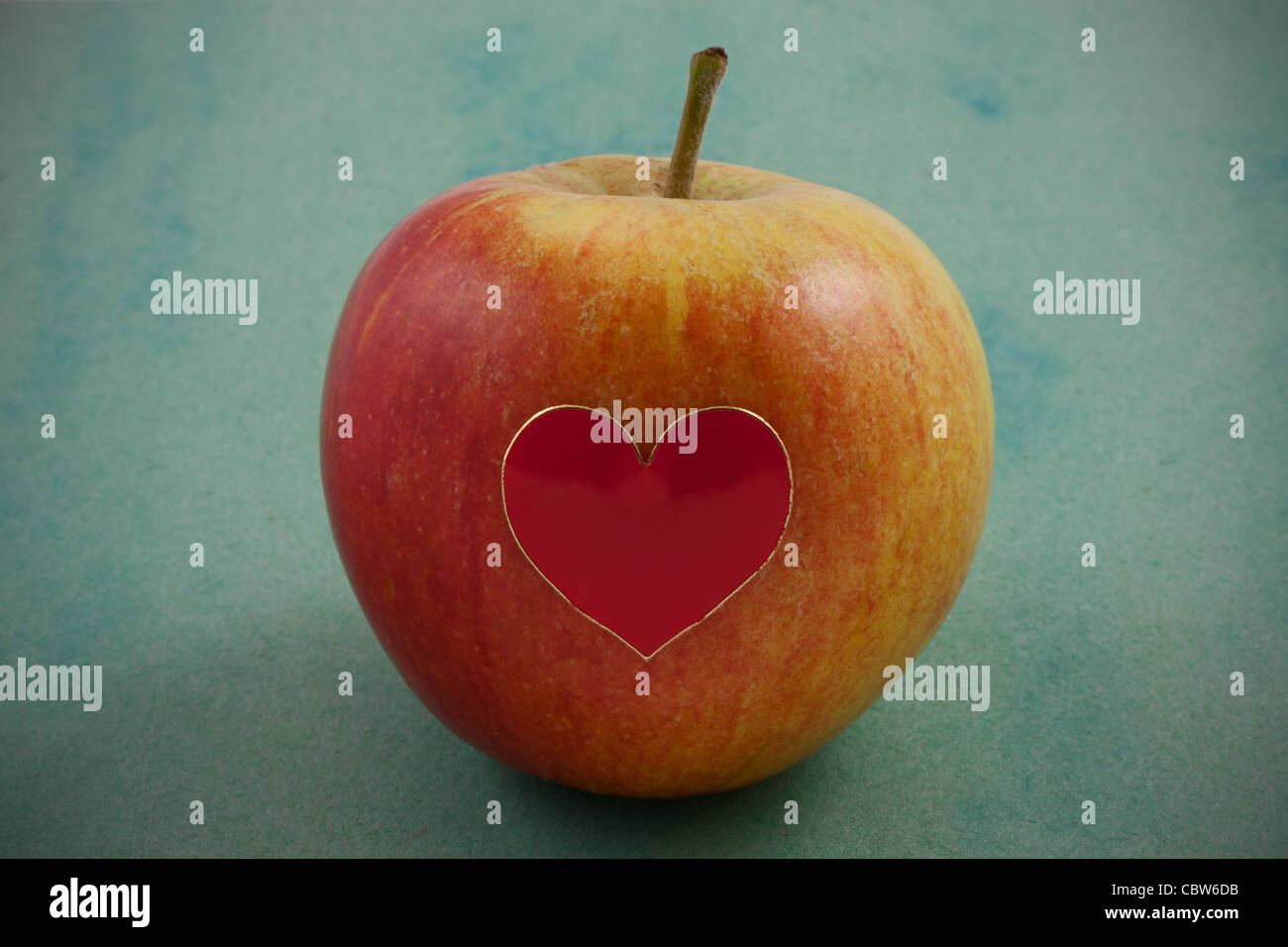 An apple with a heart Stock Photo - Alamy