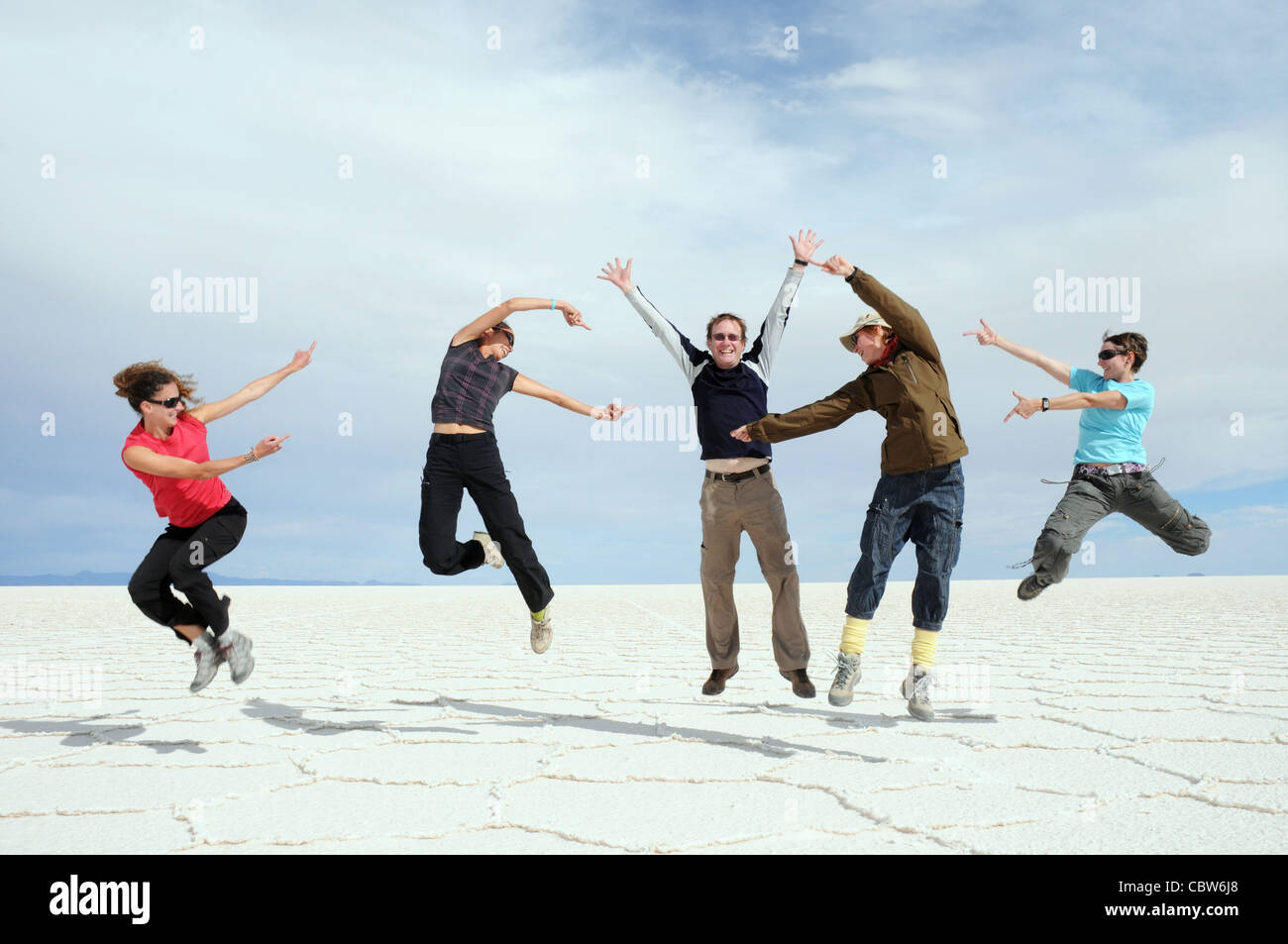 Four girls leaping high in the air in and pointing at a man Bolivia's ...