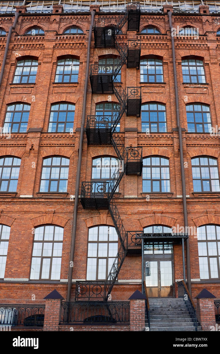 Old brick building with fire escape Stock Photo - Alamy