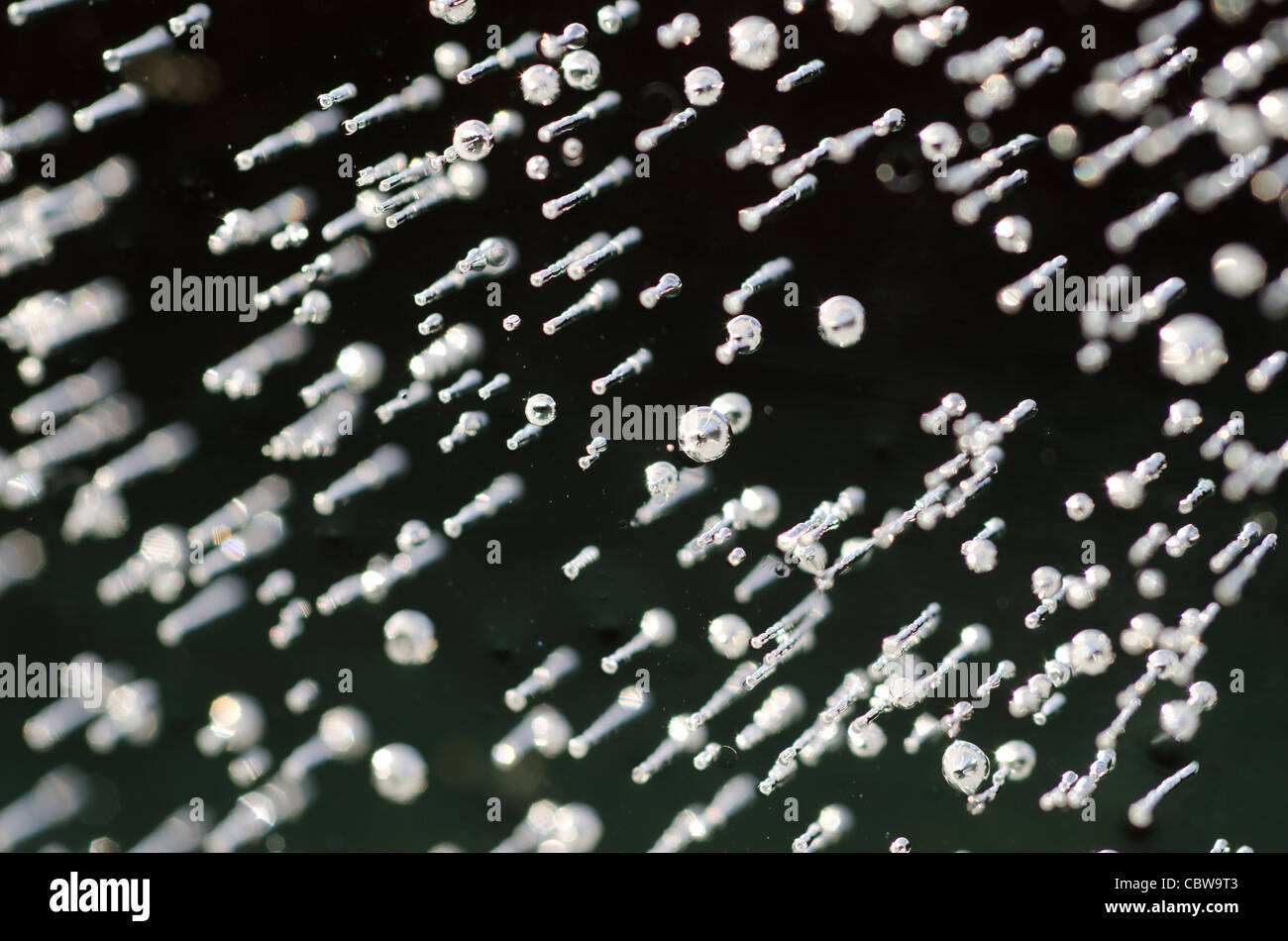 Abstract monochromatic texture of bubbles suspended in ice Stock Photo ...