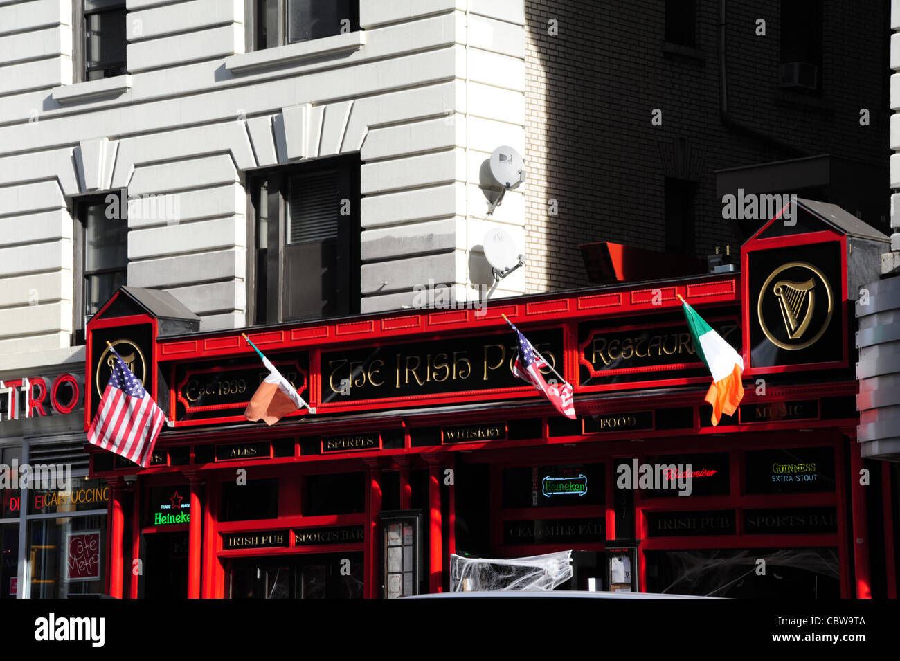 Oblique sunny view red facade, American Irish Flags flying, The Irish ...