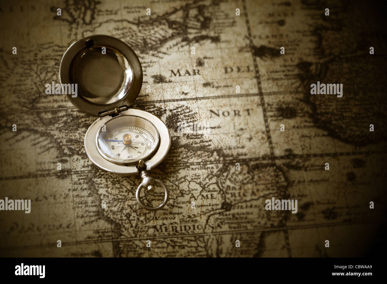 old compass on vintage map Stock Photo - Alamy