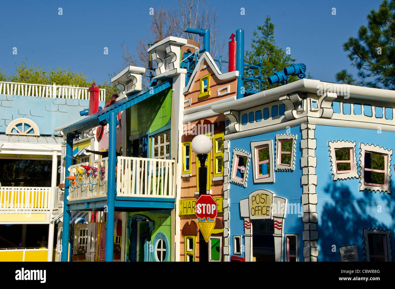 Curious George Goes To Town kids attraction kids with water guns at ...