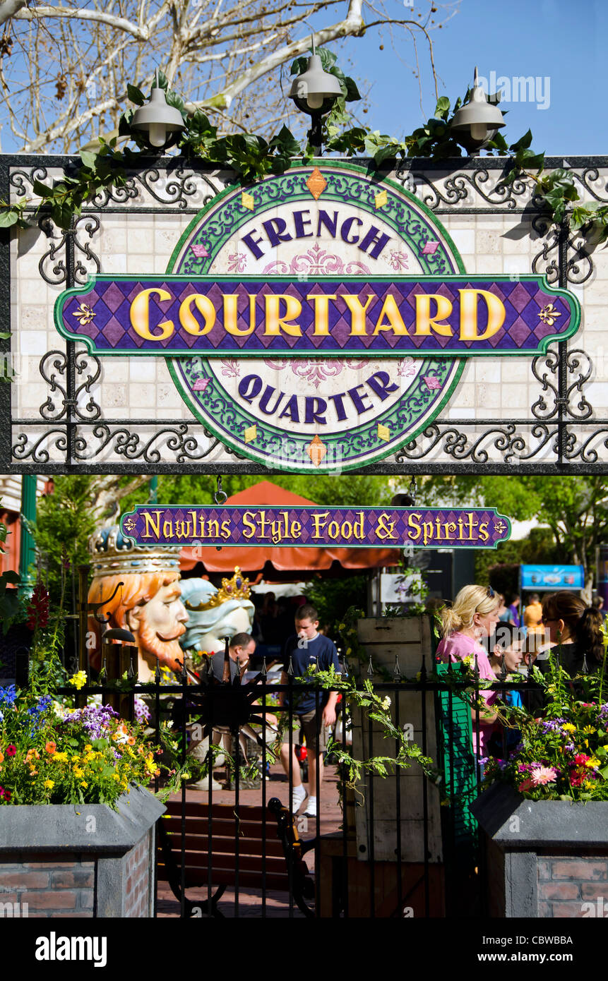 French Quarter Courtyard decorated sign and tourists at Universal ...